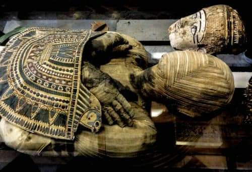Mummy from Ancient Egypt with the head wrapped in a strange linen weave ...